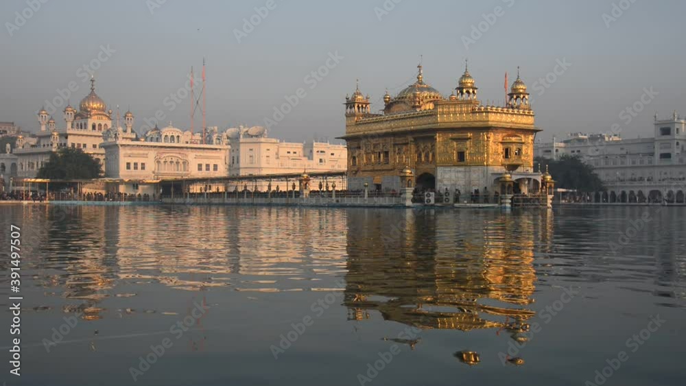 Golden temple, the holiest shrine of Sikhism reflection on the pool ...