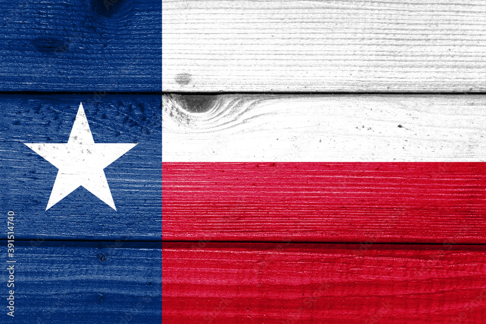 texas flag painted on old wood plank background. Brushed natural light ...