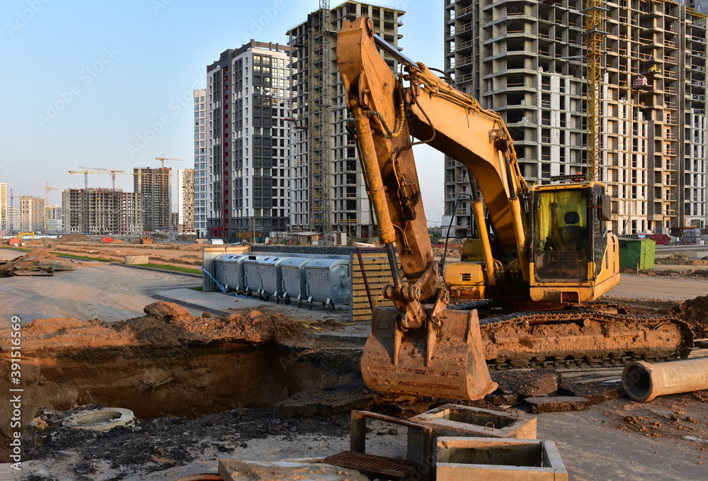 Excavator dig the trenches at a construction site. Trench for laying ...