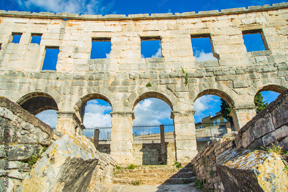Ancient heritage in Pula, Istria, Croatia. Arches of monumental Roman ...