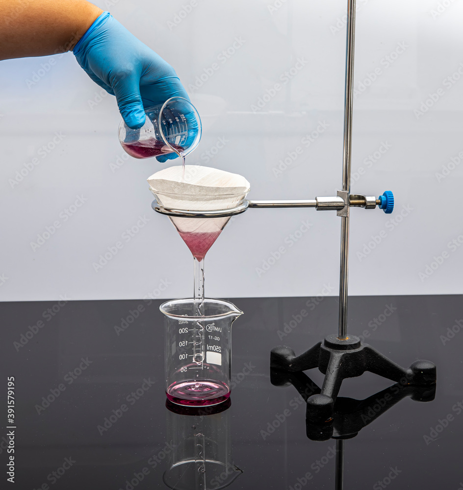 Filter paper in laboratory. Scientists are chemical filtration by ...