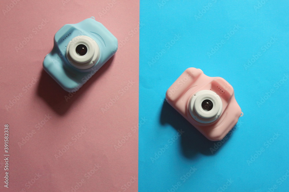 Children's camera. Two blue and cameras. The camera is located in the ...