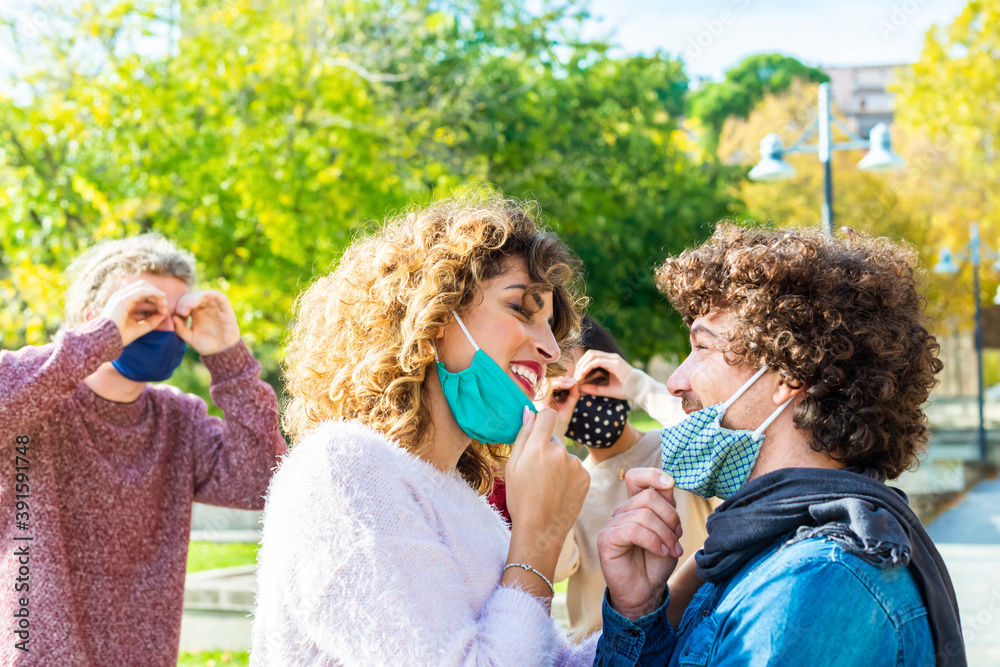 Young people having fun around city park during coronavirus outbreak ...