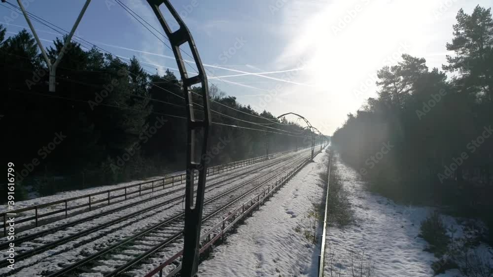 Low altitude aerial view of electric railway overhead lines and classic ...