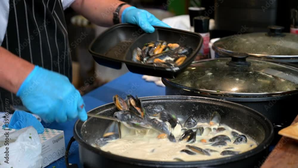 A street food vendor serving Moules Mariniere, Mussels in White Wine ...