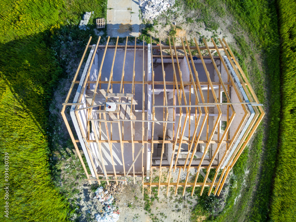 Top-down view on house under construction. Wooden roof structure ...