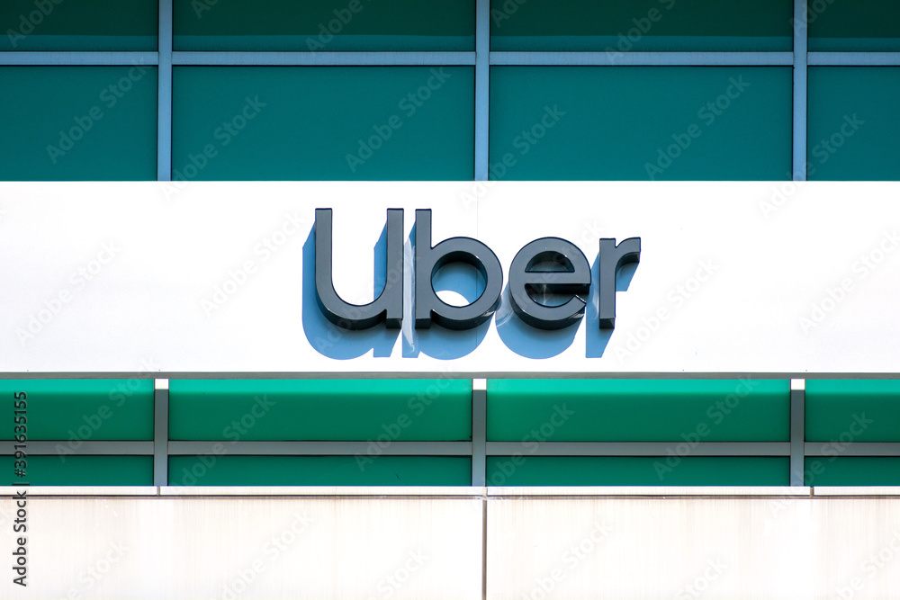 Uber sign logo at office in Silicon Valley. San Francisco based Uber ...