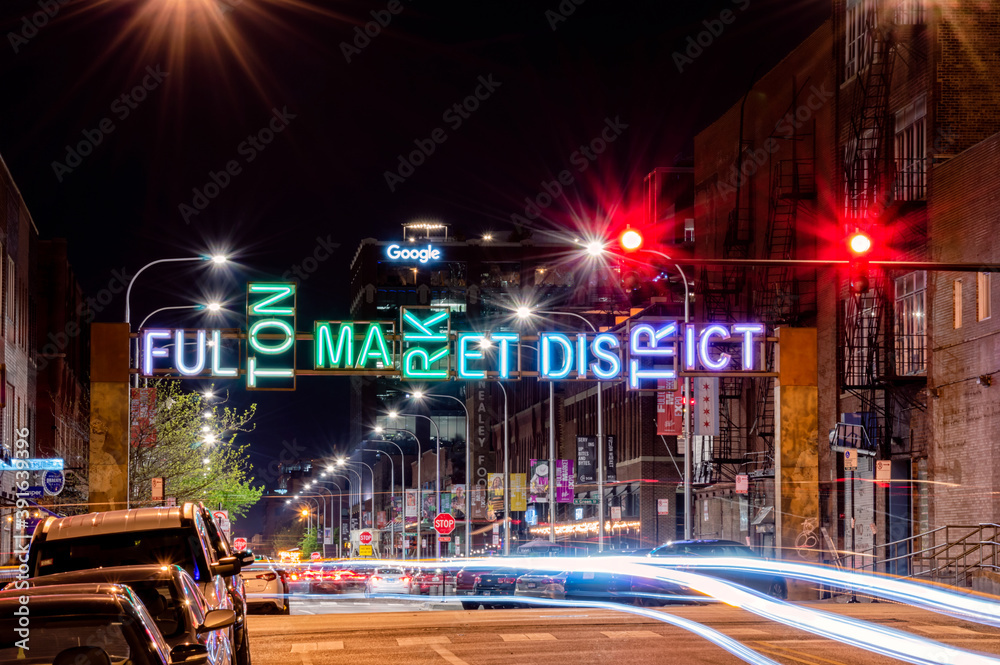 Fulton Market District Gateway sign at night with traffic light trails ...