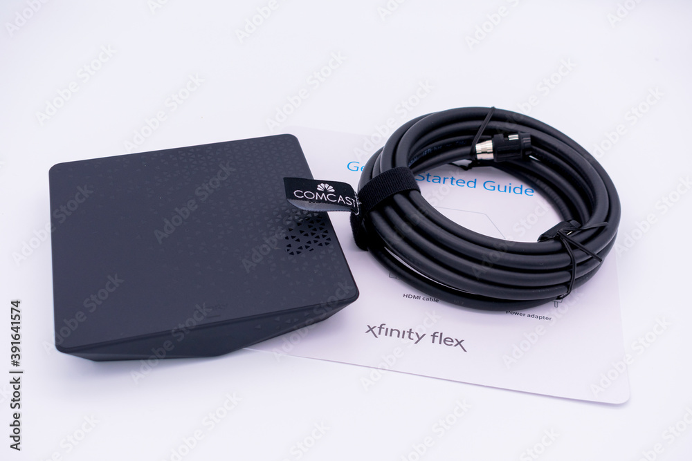 Xfinity Flex streaming TV Box, Comcast branded coaxial cable and white background - San Jose, CA ...