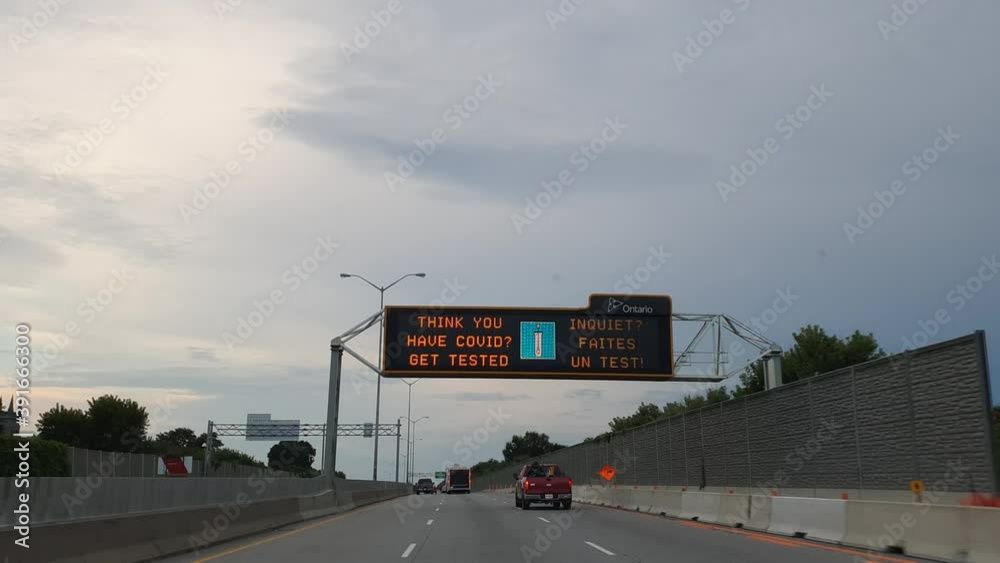 Think you have covid? Get Tested Sign on Highway Stock ビデオ | Adobe Stock