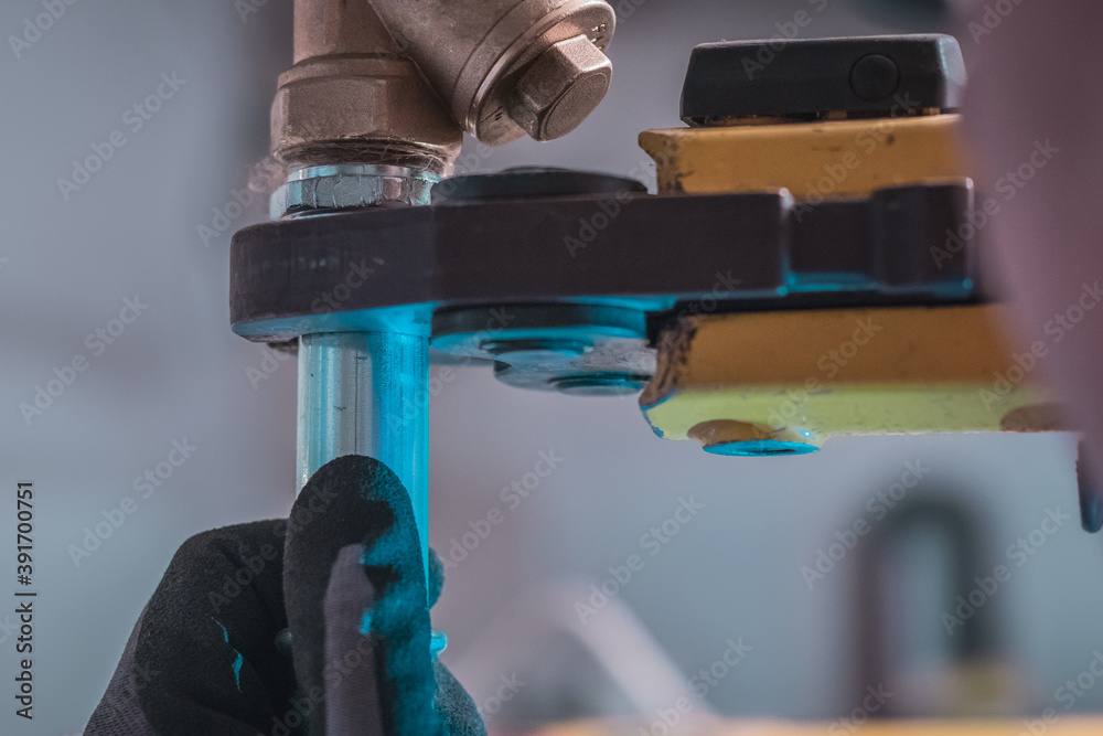 Plumber using pipe fastener or battery press tool to crimp heating or ...