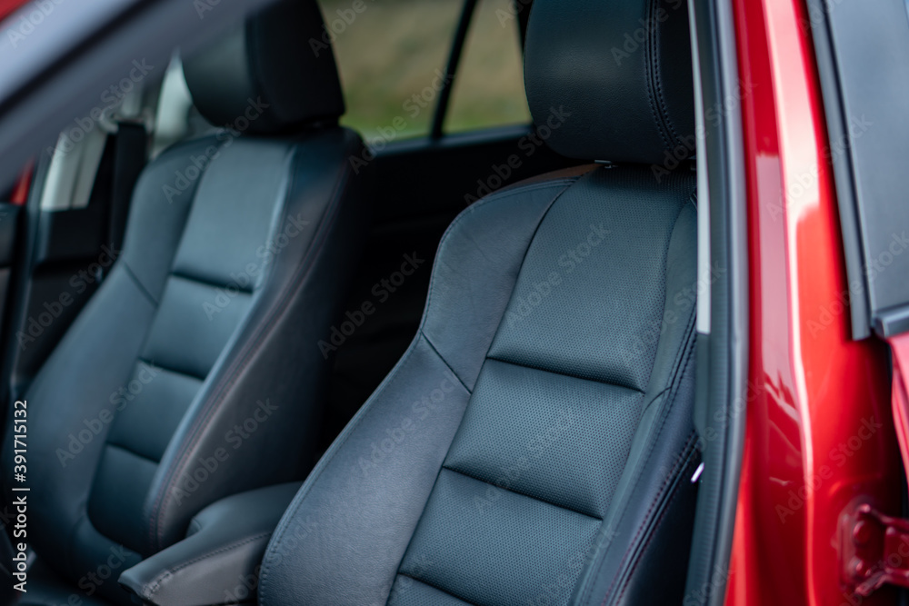 Black perforated leather car seat with macro close up isolated details ...