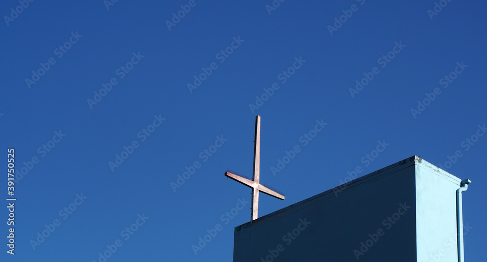 Christian cross on the building or church seen as a representation of ...