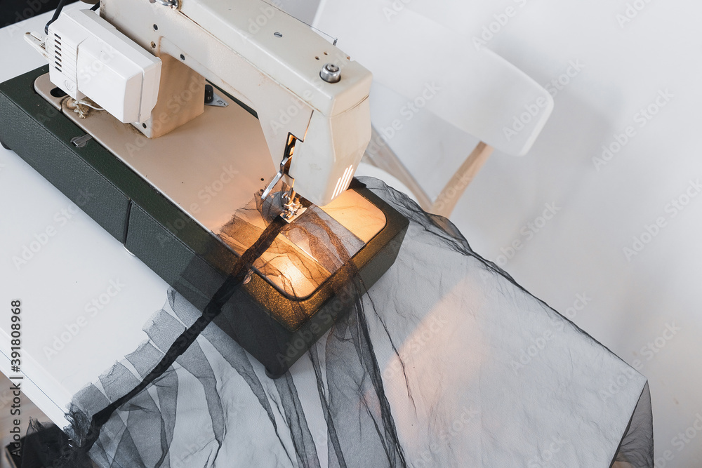 Sewing process of mesh fatin on the sewing machine at home in the ...
