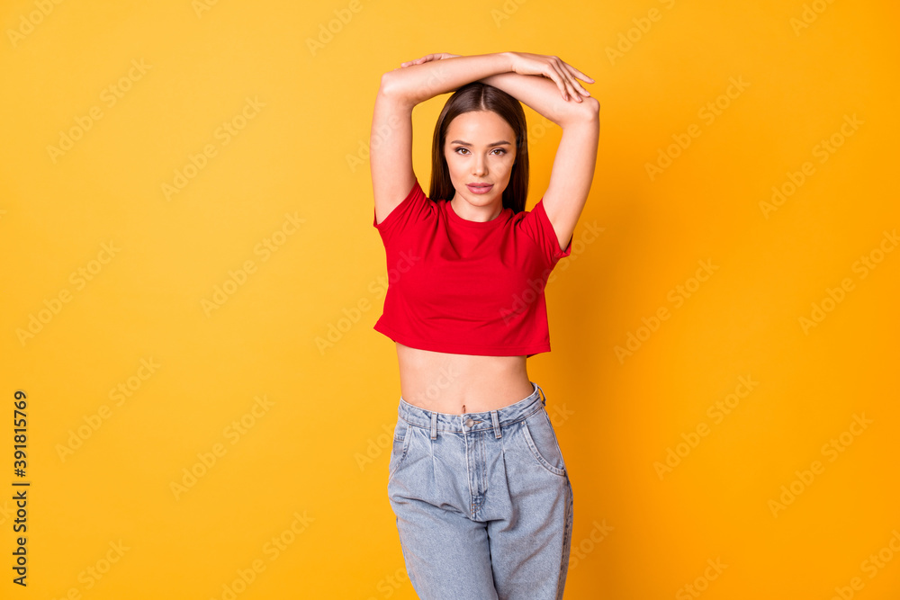 Attractive model lady raise arms posing wear casual red crop top jeans ...