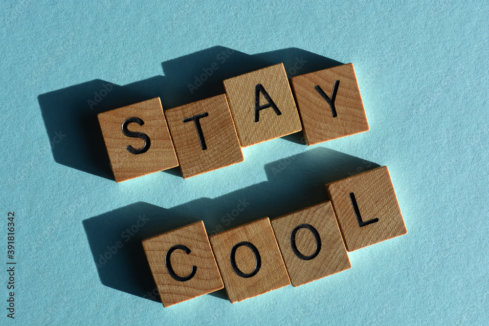 Stay Cool, words in wooden alphabet letters isolated on blue background ...