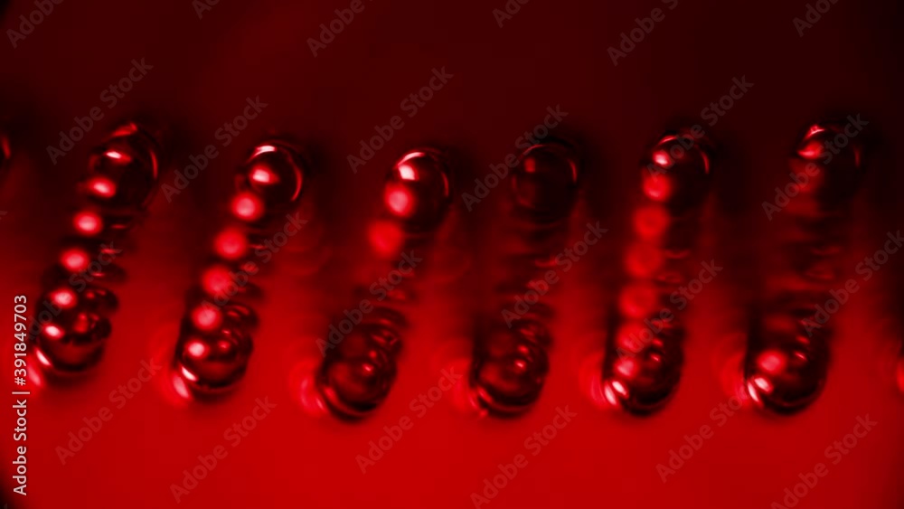 Tungsten filament under a microscope, 100 times magnification. Infrared ...