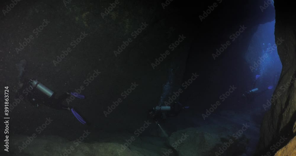 cave diving underwater scuba divers exploring caves and having fun ...