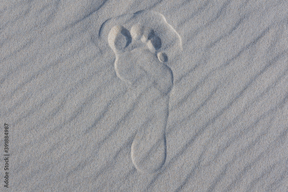 Foot mark on a beach in Debki resort village on the Baltic Sea coast in ...