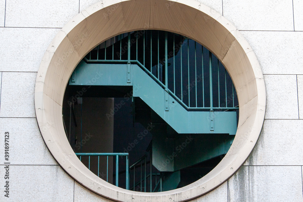 Round window and staircase photographed from the outside Stock Photo ...