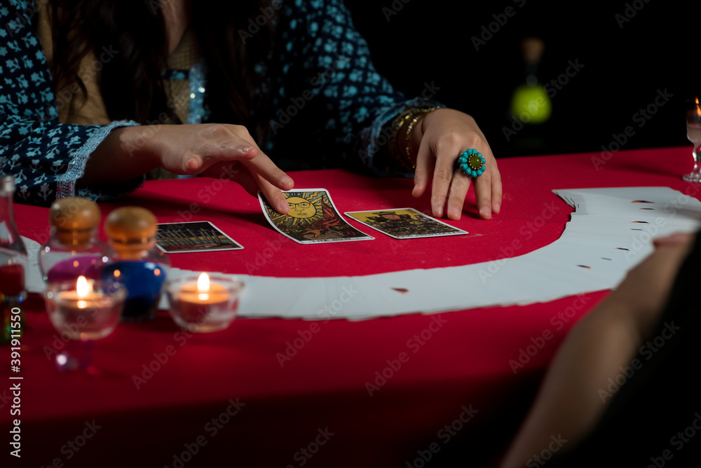 Portrait of Asian beautiful Gypsy fortune teller woman in dark room ...