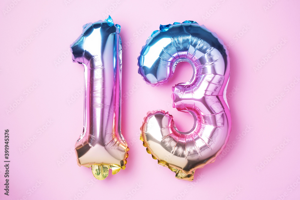 Creative layout. Rainbow foil balloon number, digit thirteen. Birthday ...