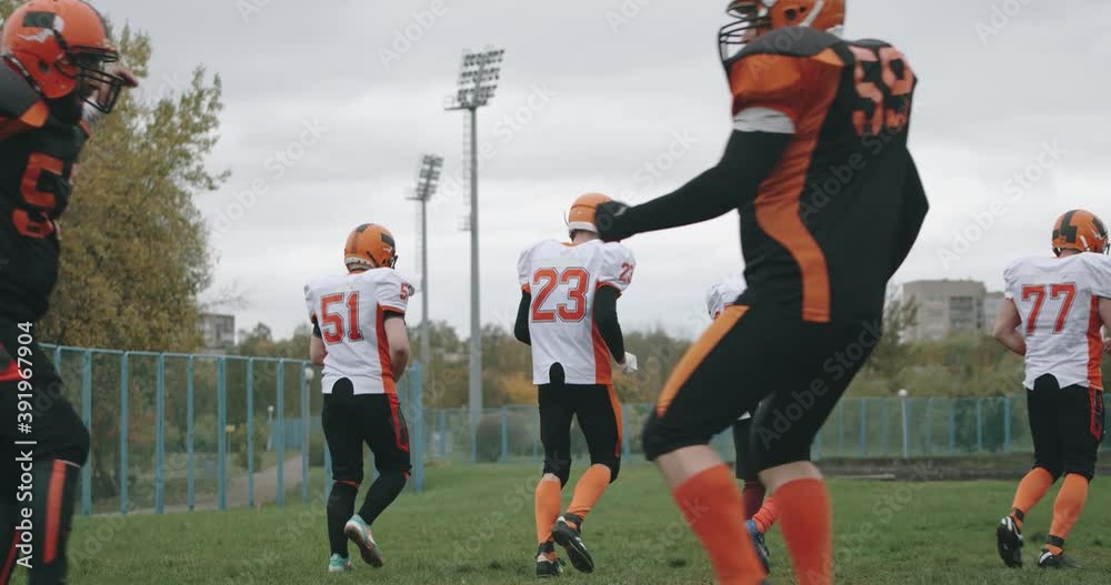 American football training day, athletic football players gets hug and ...