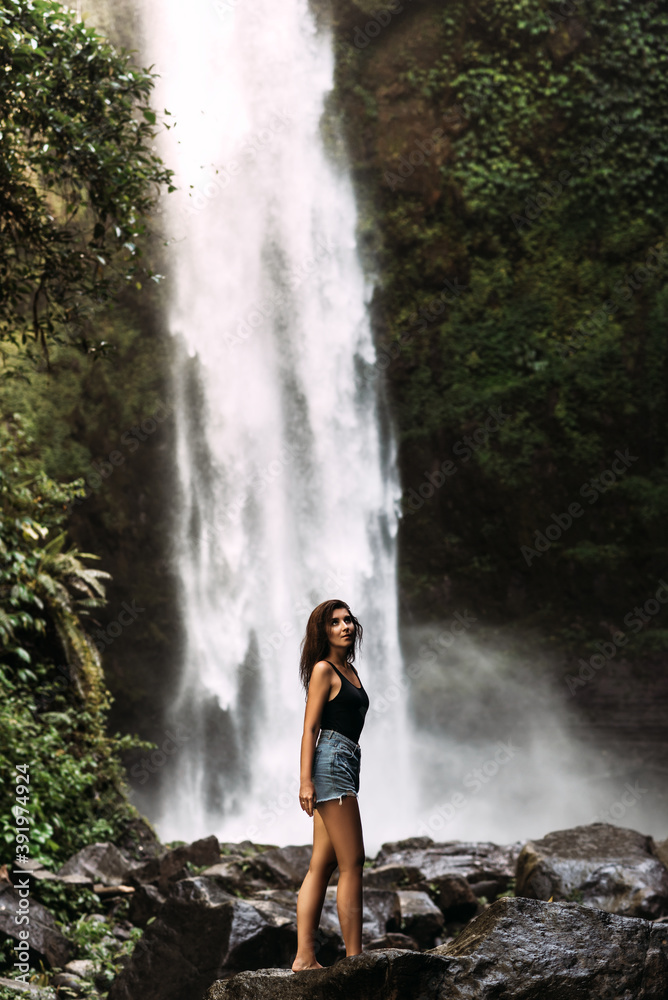 Beautiful girl at a waterfall on the island of Bali Indonesia. Sexy ...