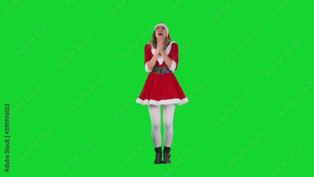 Ecstatic Santa Claus girl cheering and clapping hands screaming excited ...