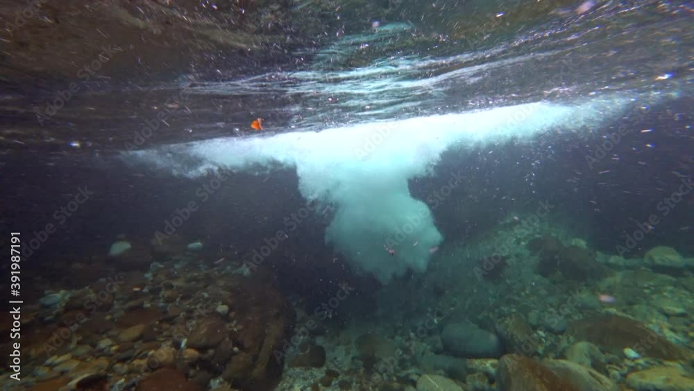 Fast flowing waters of mountain pure river and rock under transparent ...