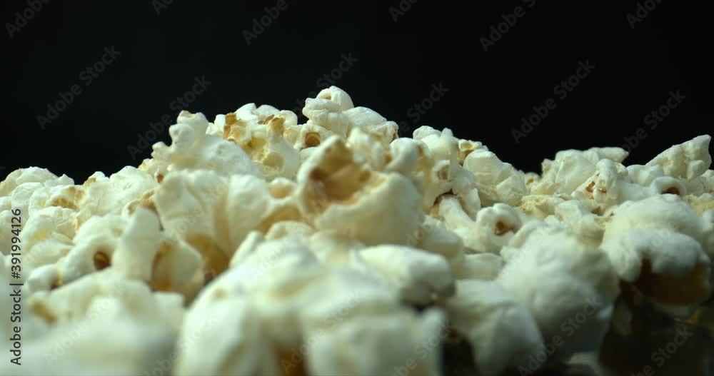 Blowing away popcorn from table. Close-up of popcorn. Popcorn texture ...
