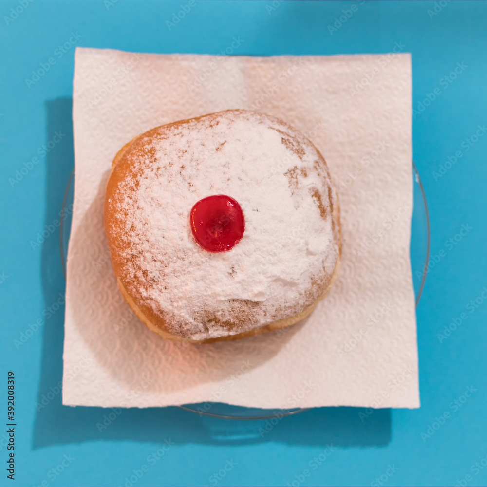 Hanukkah mocks sufganiyah (doughnut) on white background, top view ...