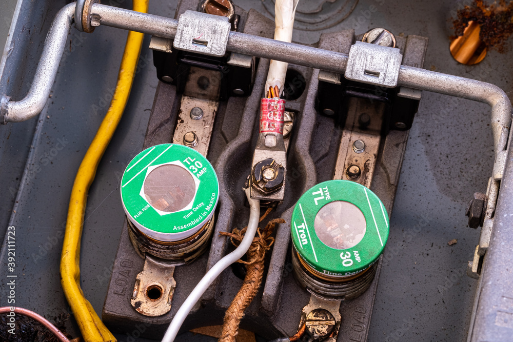 Old electrical fuse box with two fuses Stock Photo | Adobe Stock