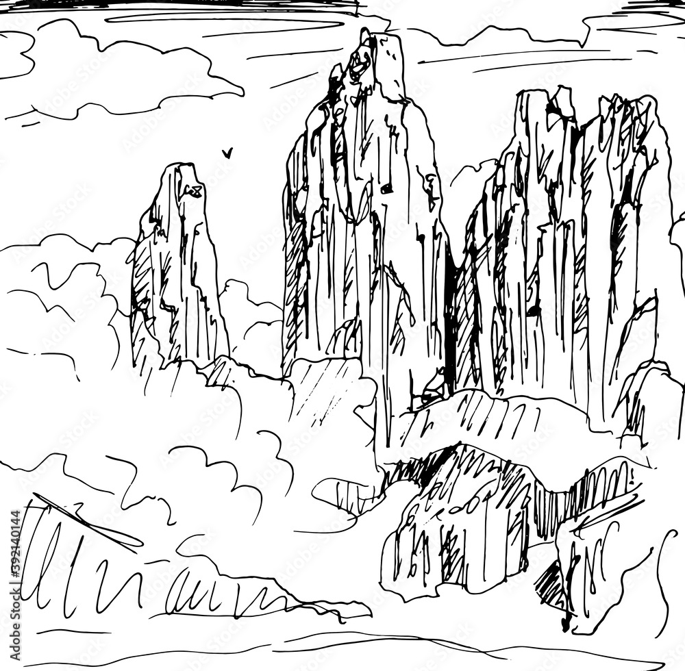Torres del Paine peaks amid clouds. Steep cliffs in Patagonia, a region ...
