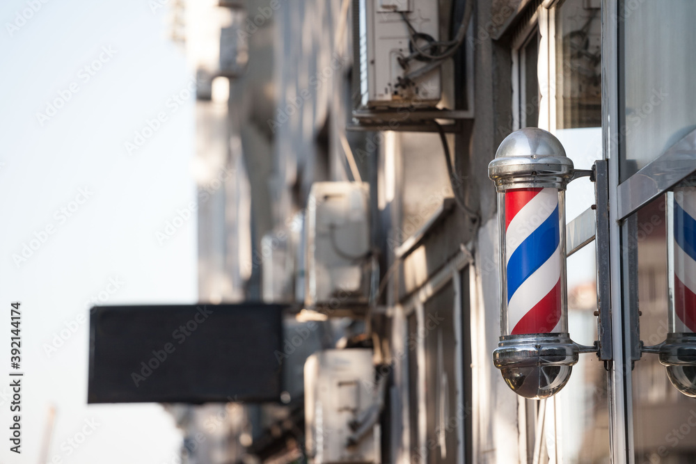Typical American barbers pole seen in front of a barber shop. This pole ...