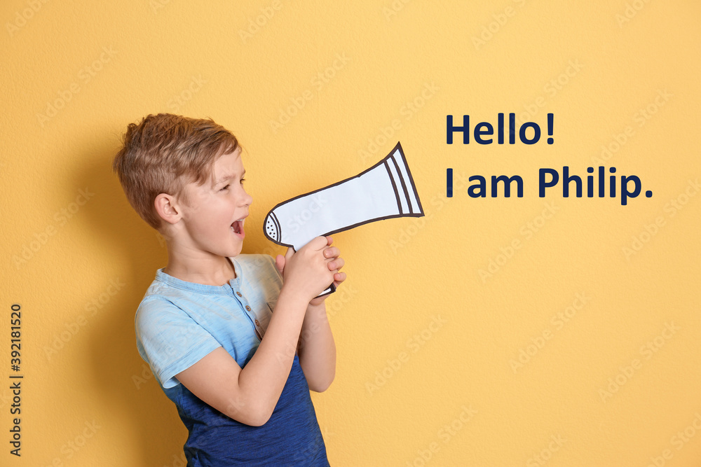 Cute little boy saying Hello! I Am Philip using paper megaphone on ...