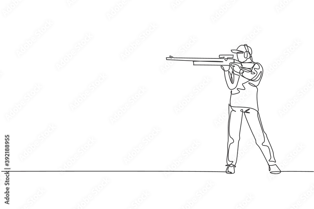 One continuous line drawing young man on shooting training ground ...