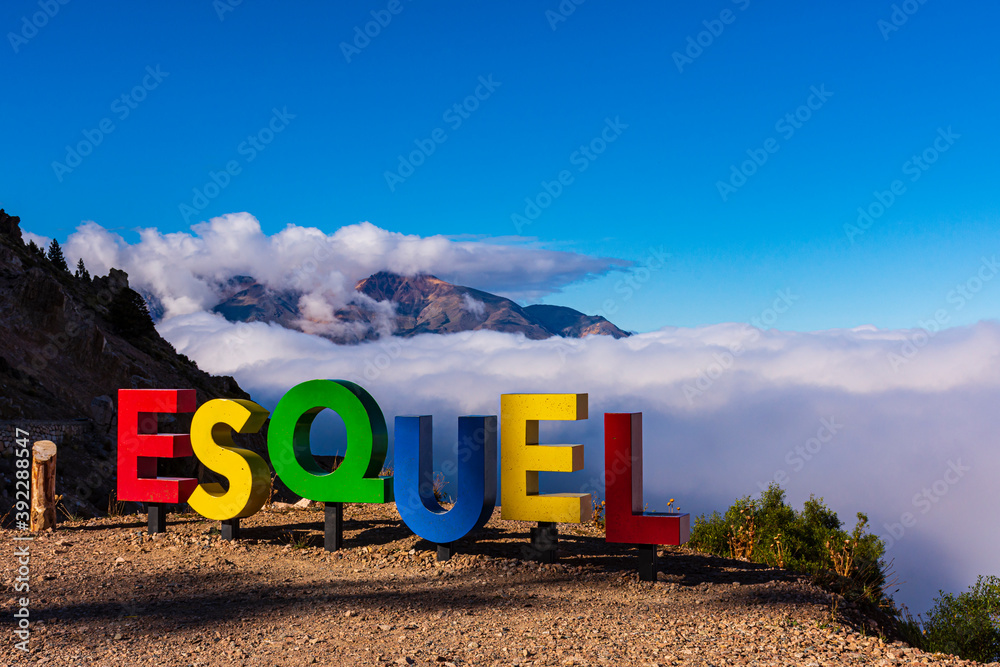 Esquel sign lookout point against Andes mountains and clouds in ...
