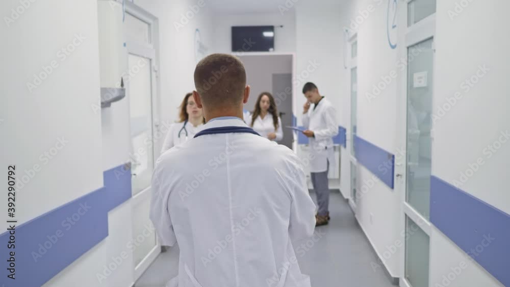 Back View of Determined Doctor Wearing White Coat with Stethoscope ...