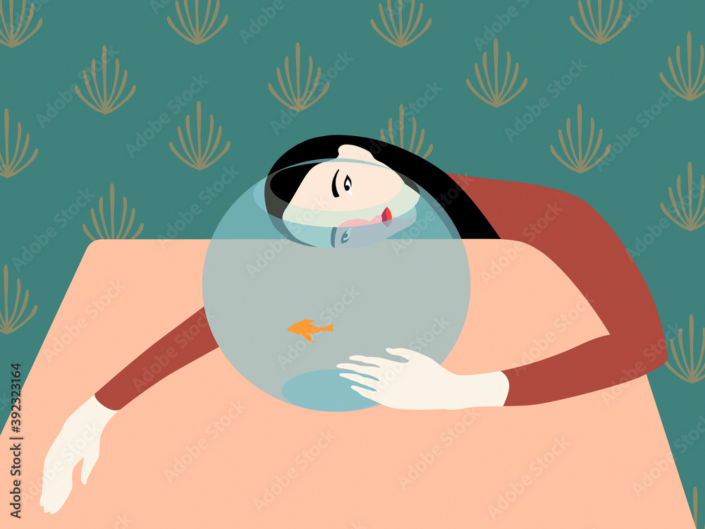 Young woman looking at fishbowl Stock Photo | Adobe Stock