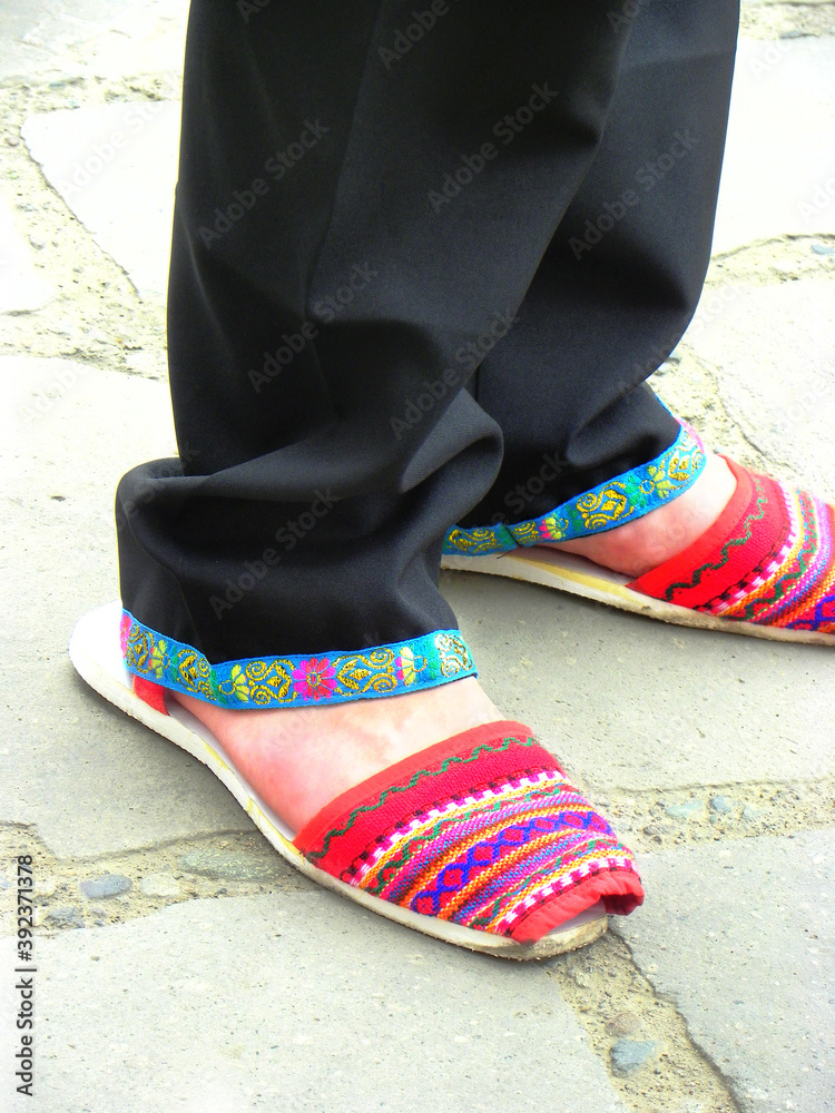Feet of indigenous man dancer in "alpargatas" which is traditional ...
