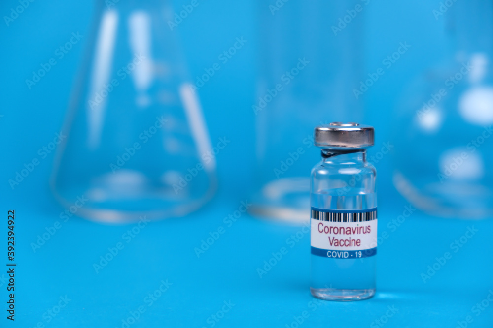 Covid-19 coronavirus vaccine concept - one glass vials with metal caps ...