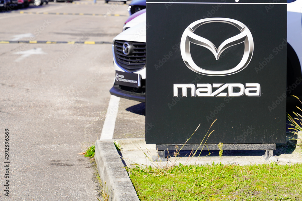 Mazda logo and text sign of dealership shop Japanese car automaker ...