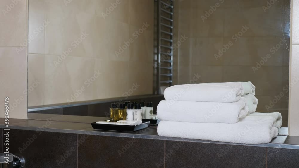 Inside of hotel apartments. Bathroom amenities: shower gel, shampoo ...