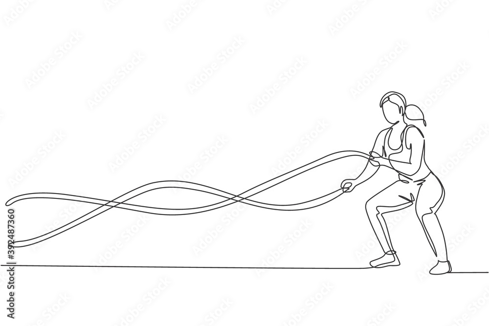 One continuous line drawing young woman training battle rope in fitness ...