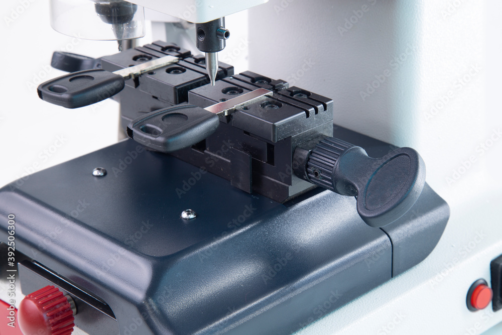 Production of car keys on a specialized key machine. Stock Photo ...