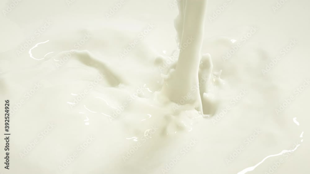 pouring cream milk , milk splash in slow motion pouring fresh milk ...