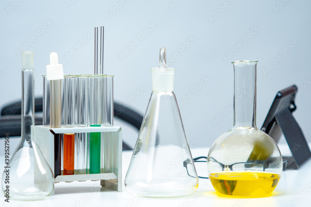 Labaratory glasses are located on table. Test tubes of various shapes ...