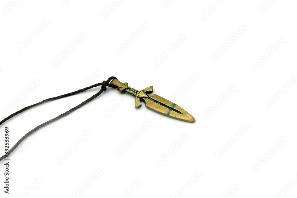 amulet in the shape of a sword on a white background Stock Photo ...