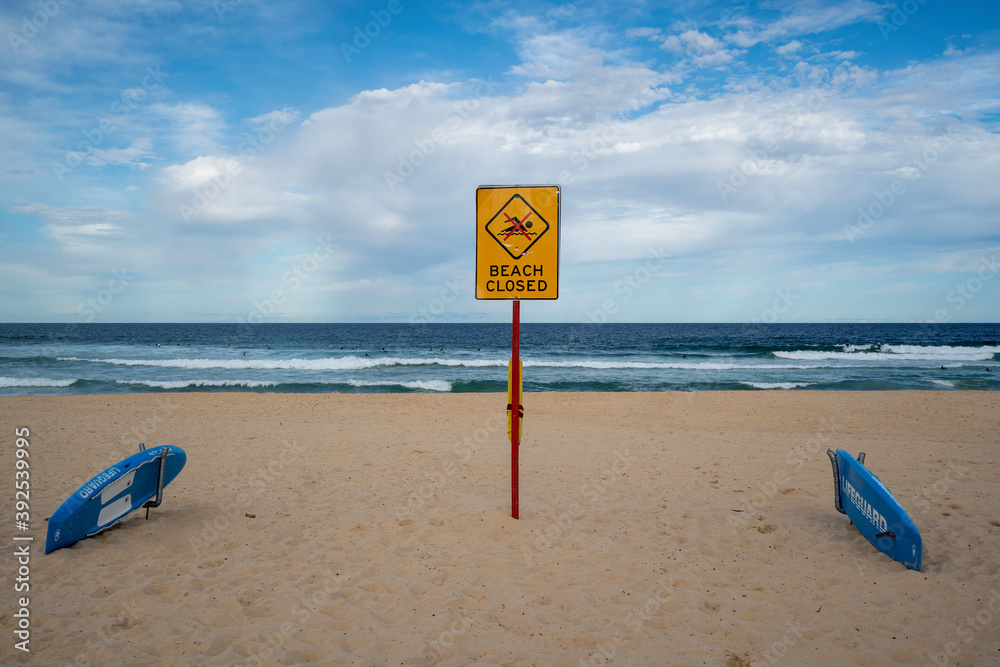 Beach closed sign at Beach due to rough seas and too dangerous for ...
